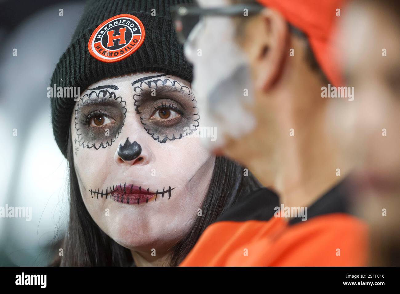 HERMOSILLO, MEXICO - OCTOBER 31: A female baseball fan attends the game ...
