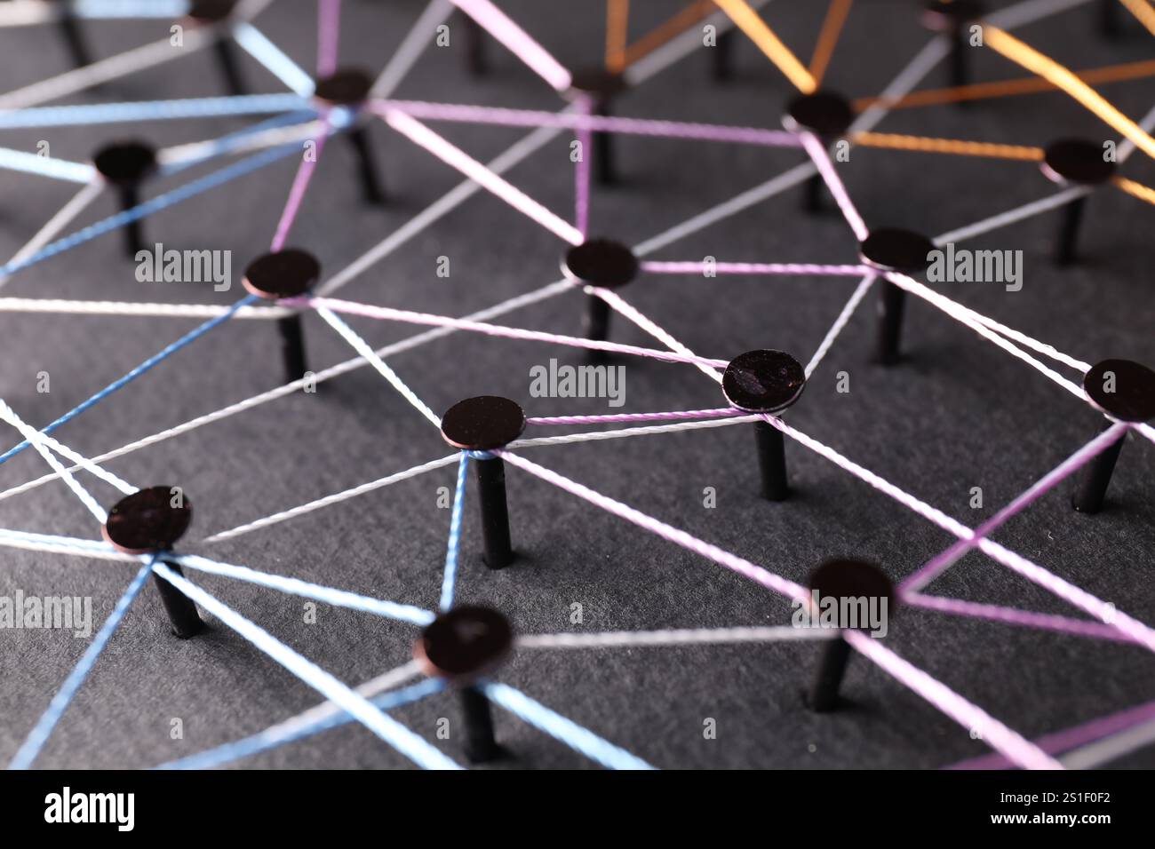 Network connection. Nails linked together by threads on black ...