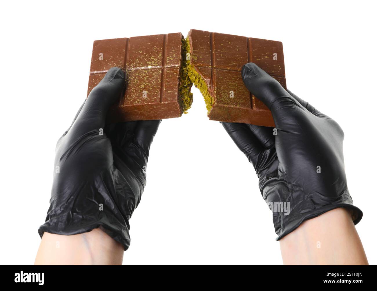 Woman breaking Dubai chocolate bar with pistachio and knafeh on white ...