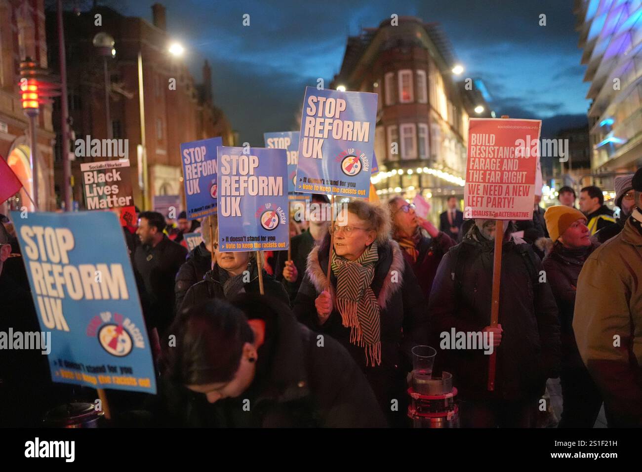 People hold a protest outside the Reform UK East Midlands Conference at ...