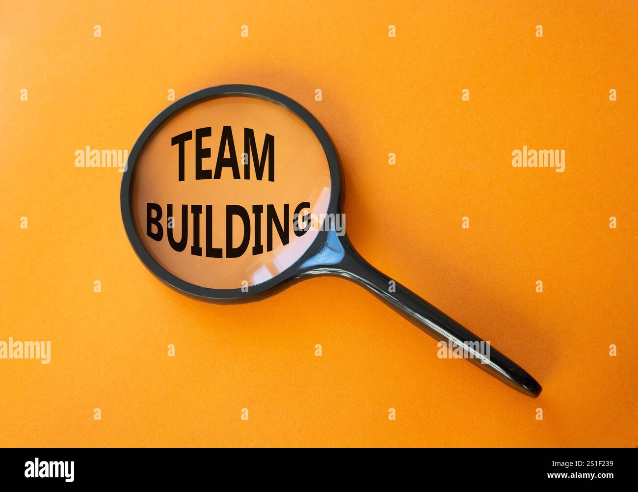 Team Building symbol. Concept word Team Building on magnifying glass ...