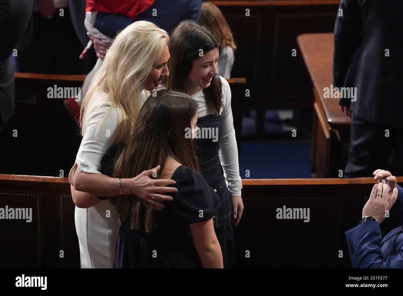 Rep. Marjorie Taylor-Greene, R-Ga., takes a photo with children of ...