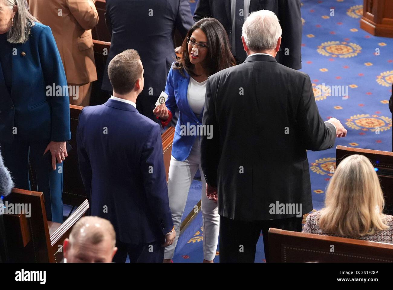 Rep. Lauren Boebert, R-Colo., speaks with members as the House of ...