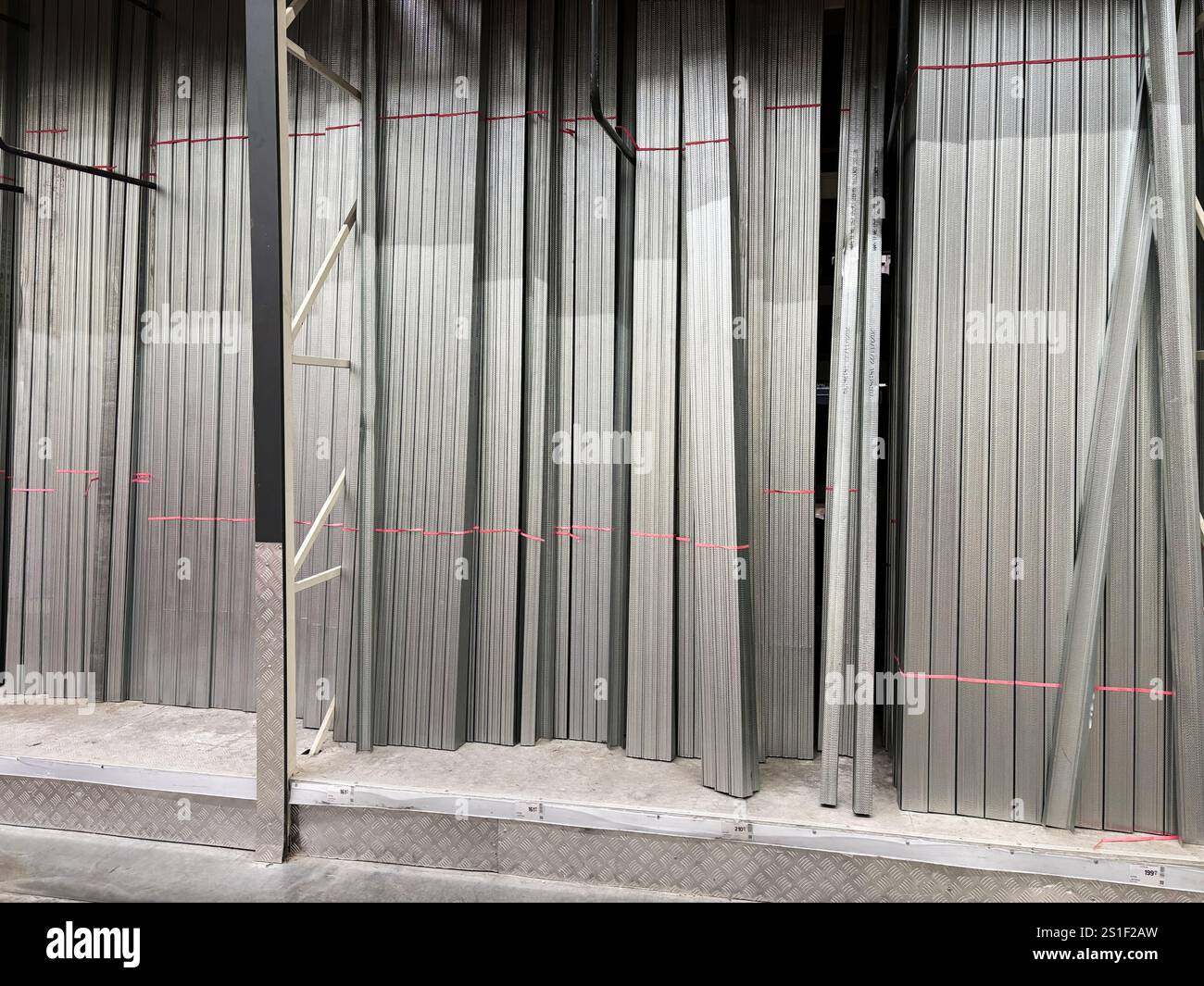 Kyiv, Ukraine - January 03, 2025: Tall vertical metal beams neatly ...