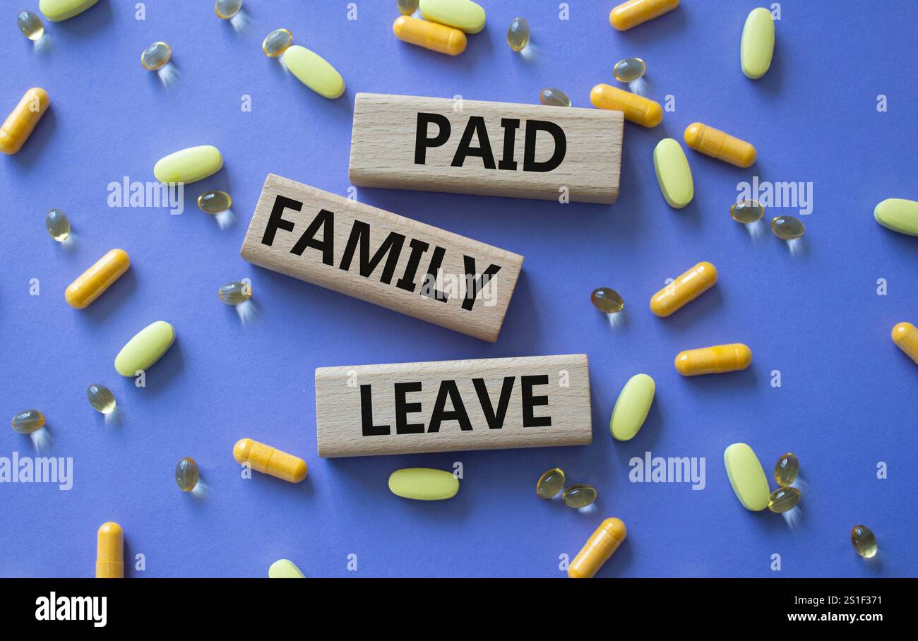 Paid Family Leave symbol. Concept words Paid Family Leave on wooden ...
