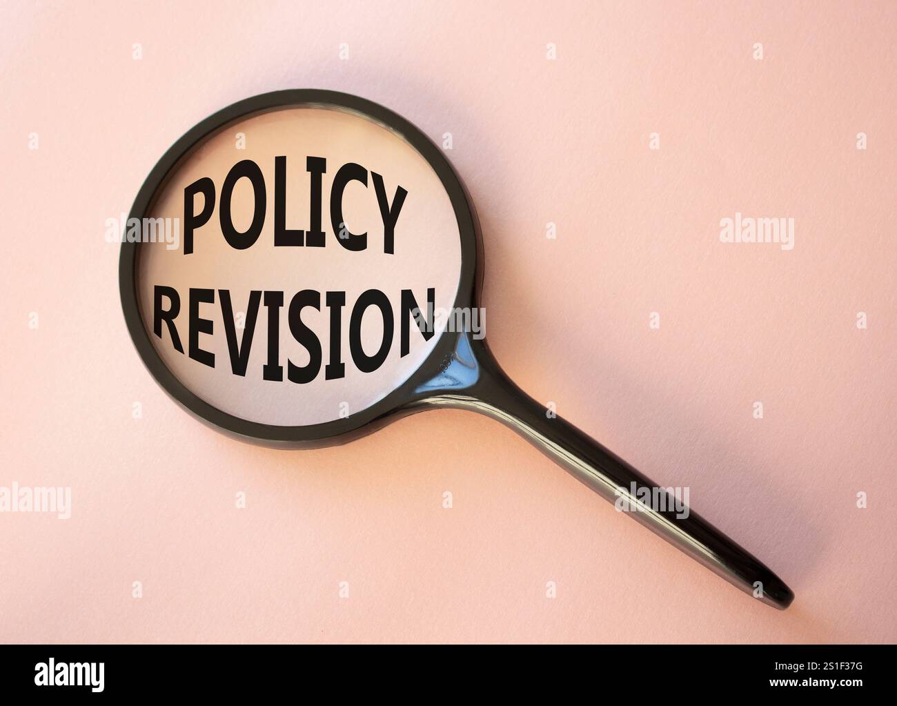 Policy revision symbol. Concept word Policy revision on magnifying ...