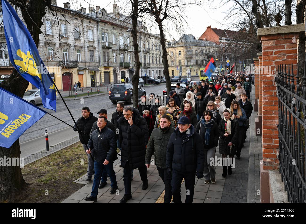 LVIV, UKRAINE - JANUARY 1, 2025 - People walk from the Stepan Bandera ...