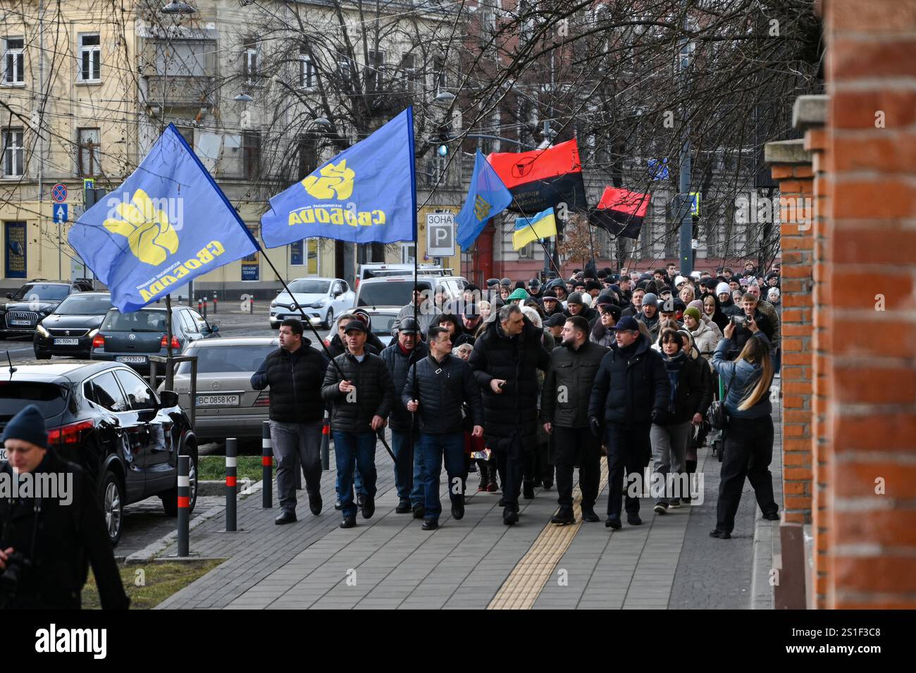 LVIV, UKRAINE - JANUARY 1, 2025 - People walk from the Stepan Bandera ...