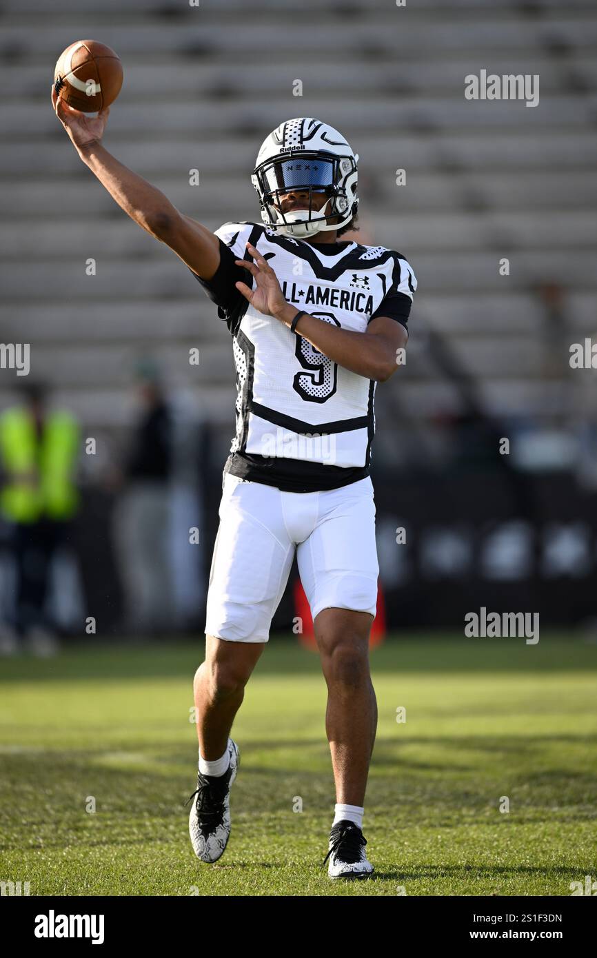 Team Unstoppable quarterback KJ Lacey (9) warms up before the Under ...