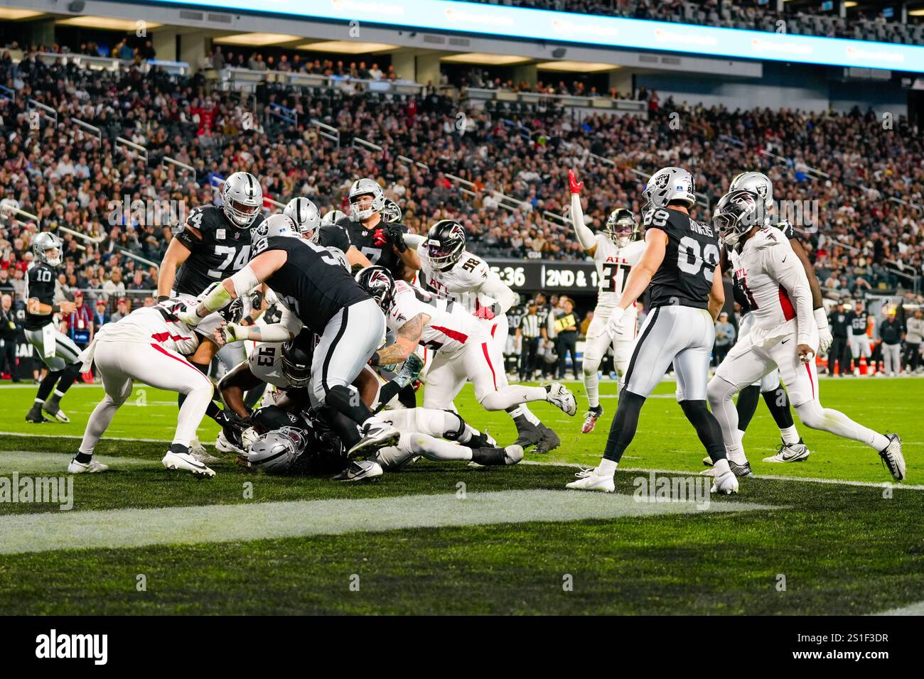 Alexander Mattison #22 of the Las Vegas Raiders is stopped by the ...