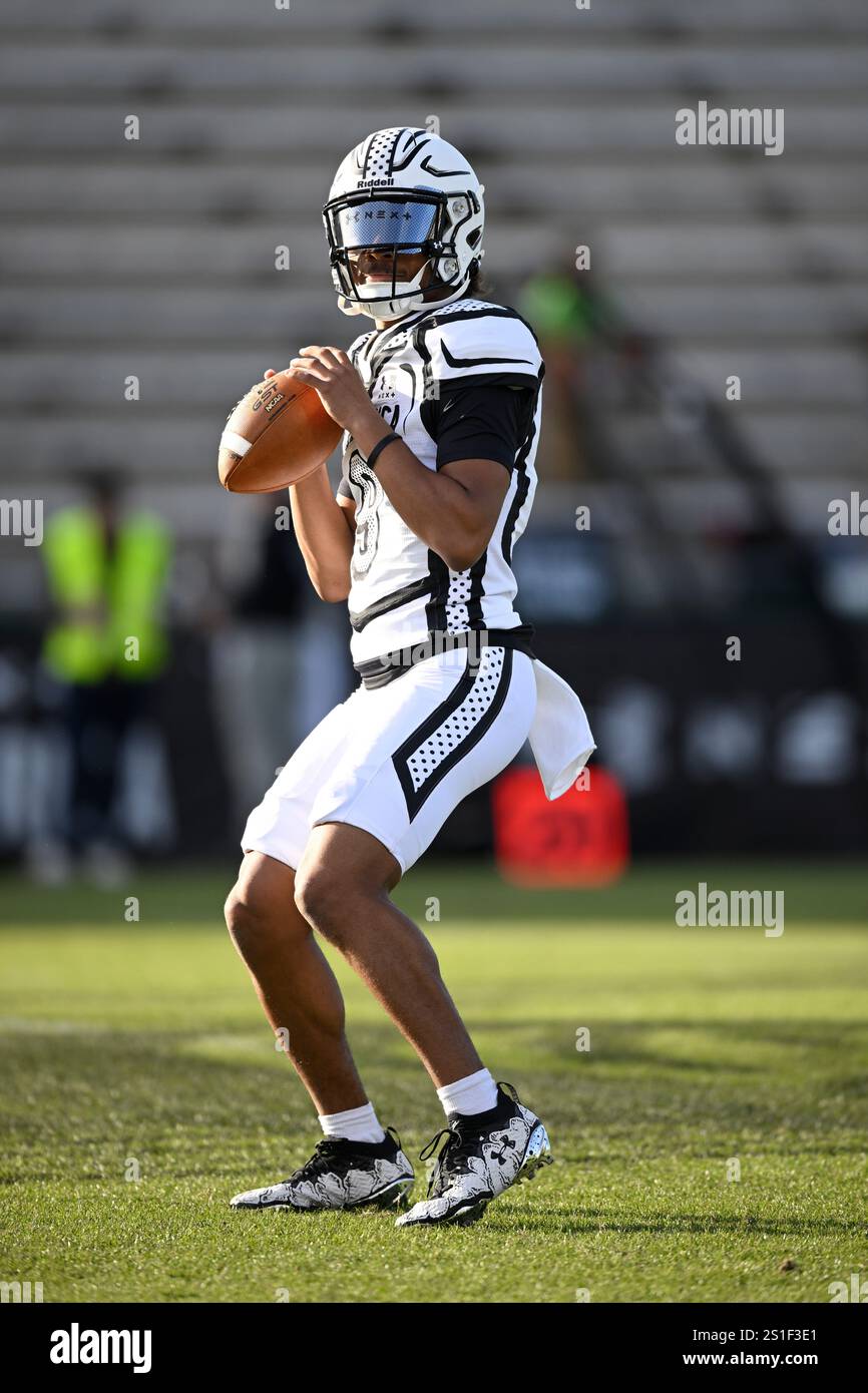 Team Unstoppable quarterback KJ Lacey (9) warms up before the Under ...