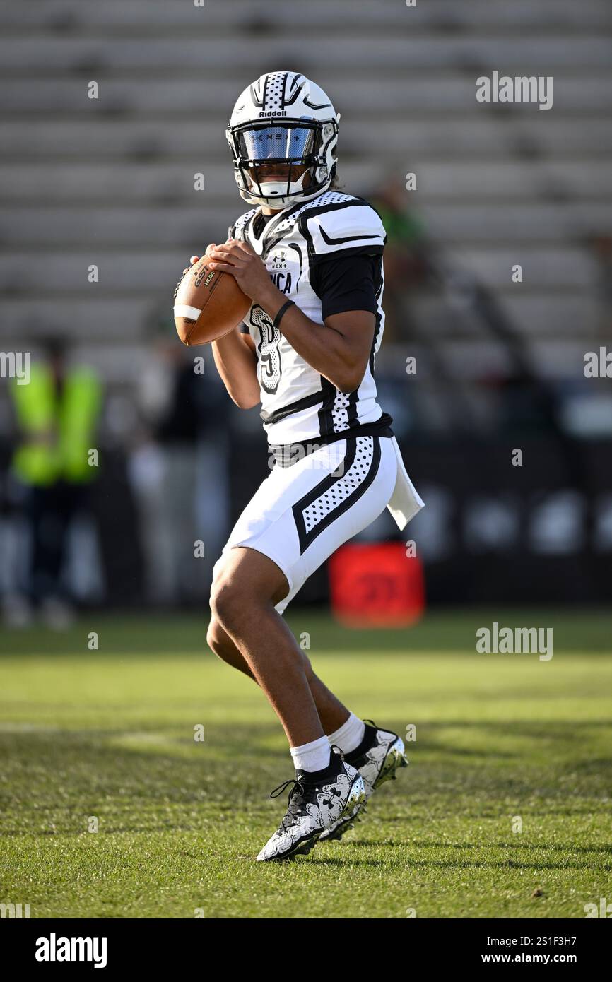 Team Unstoppable quarterback KJ Lacey (9) warms up before the Under ...