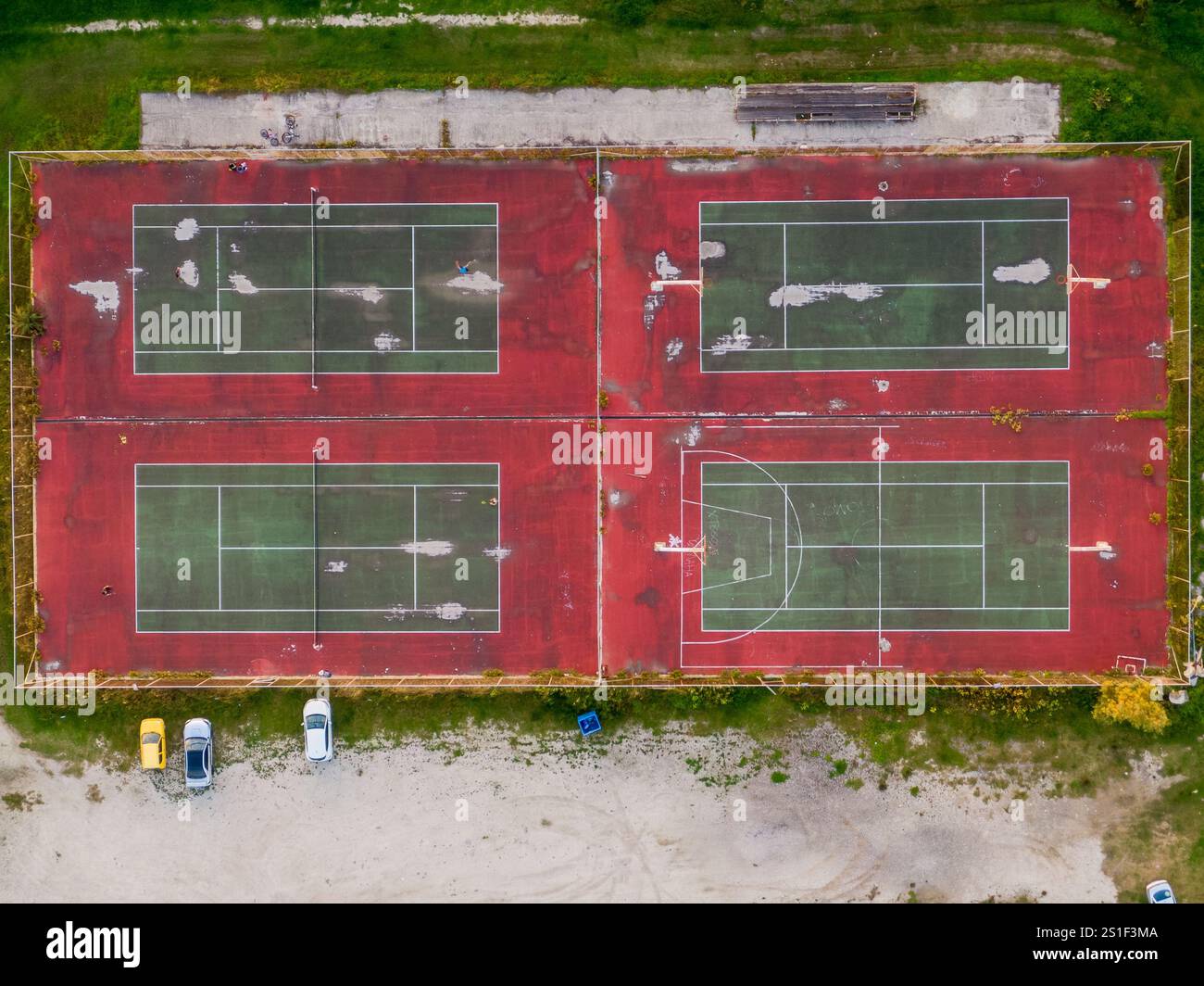 Overgrown courts: tennis and basketball courts seen from above Stock ...