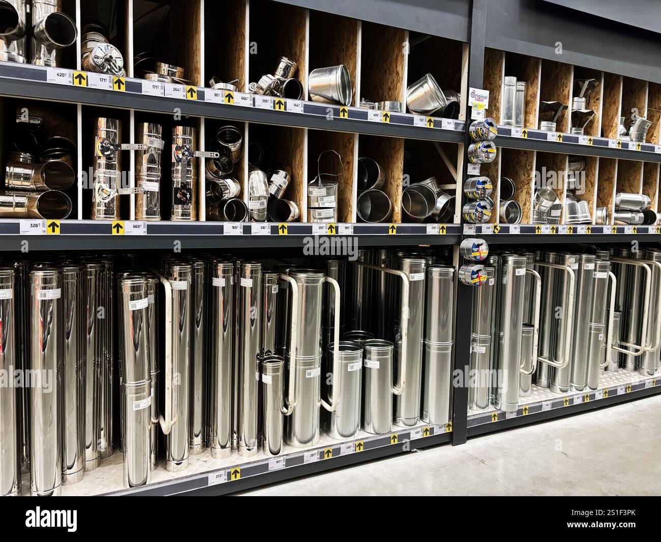Kyiv, Ukraine - January 03, 2025: Rows of metal shelves in a hardware ...