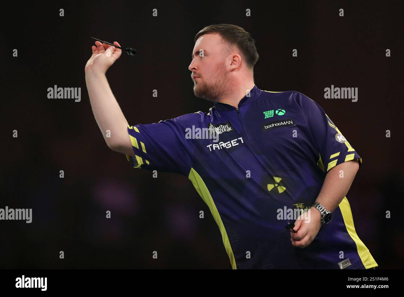 Luke Littler throws during the Paddy Power World Darts Championship ...