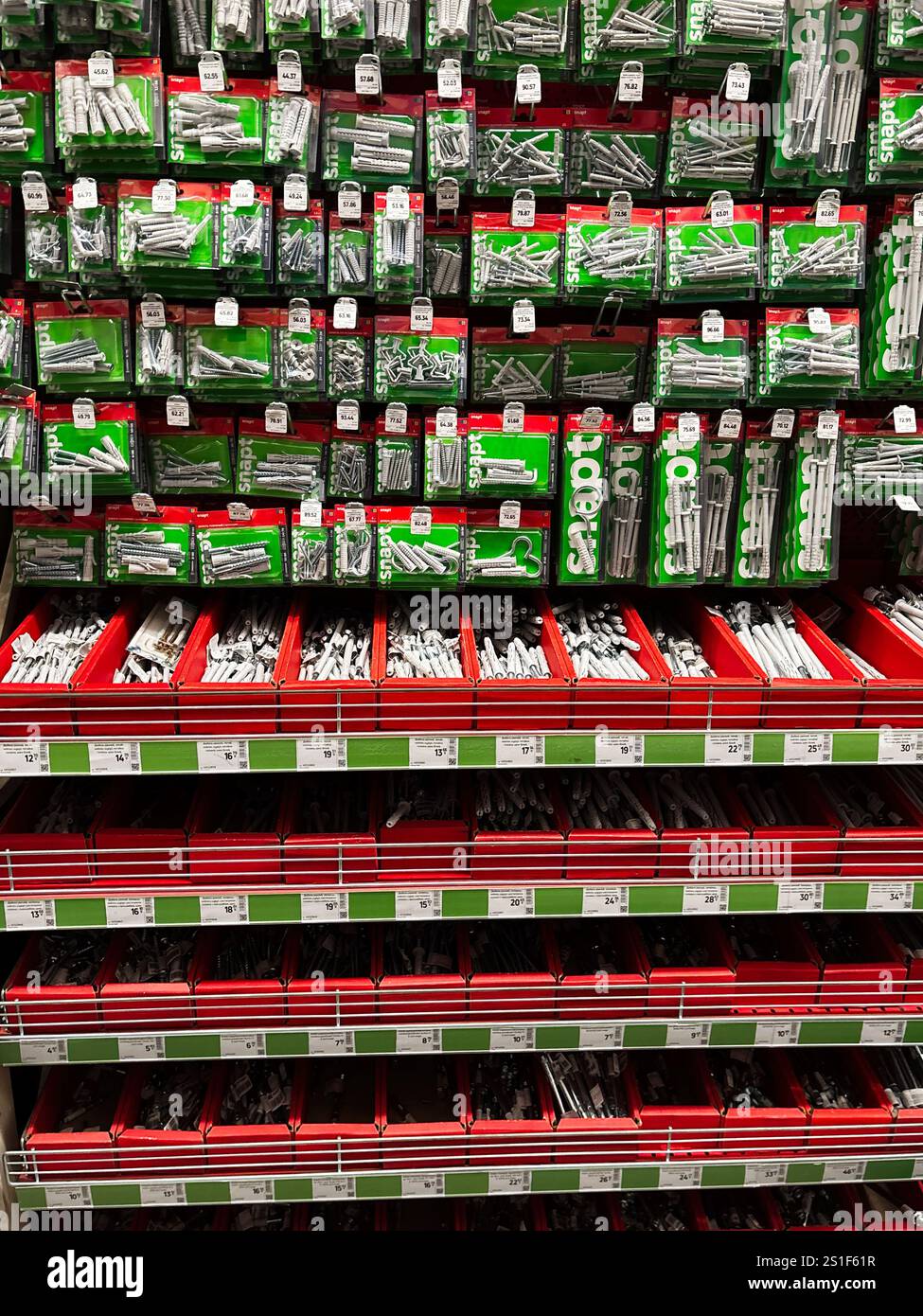 Kyiv, Ukraine - January 03, 2025: Organized display of screws, anchors ...