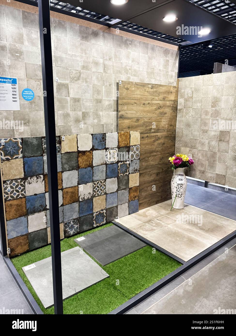 Kyiv, Ukraine - January 03, 2025: Indoor showroom presenting assorted floor and wall tile ...