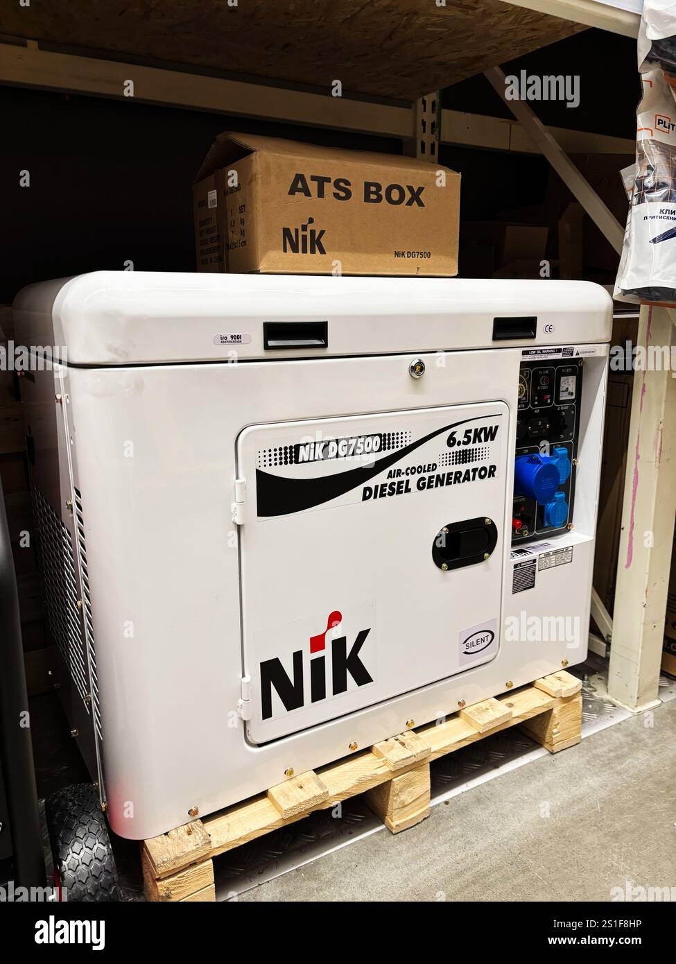 Kyiv, Ukraine - January 03, 2025: Diesel generator unit with ATS box on ...