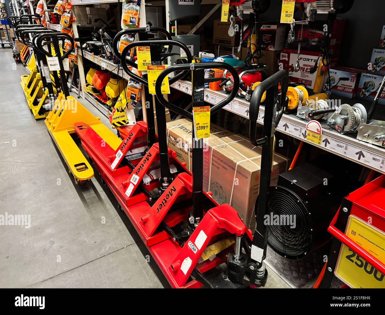 Kyiv, Ukraine - January 03, 2025: Pallet jacks and various industrial ...