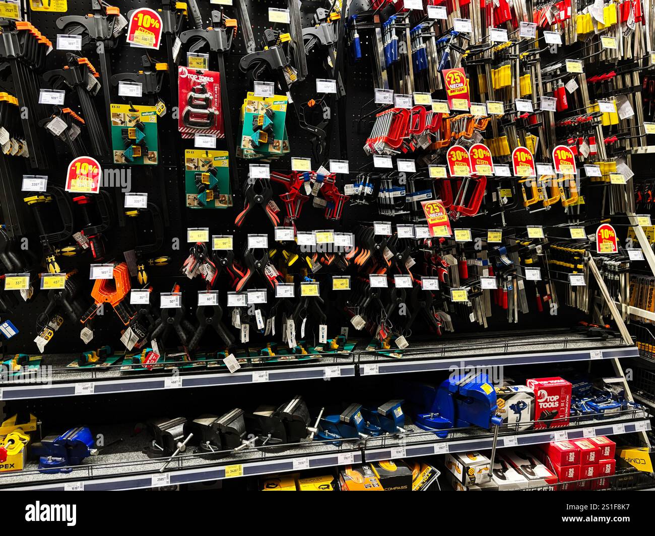 Kyiv, Ukraine - January 03, 2025: Brightly lit hardware store display featuring various hand ...