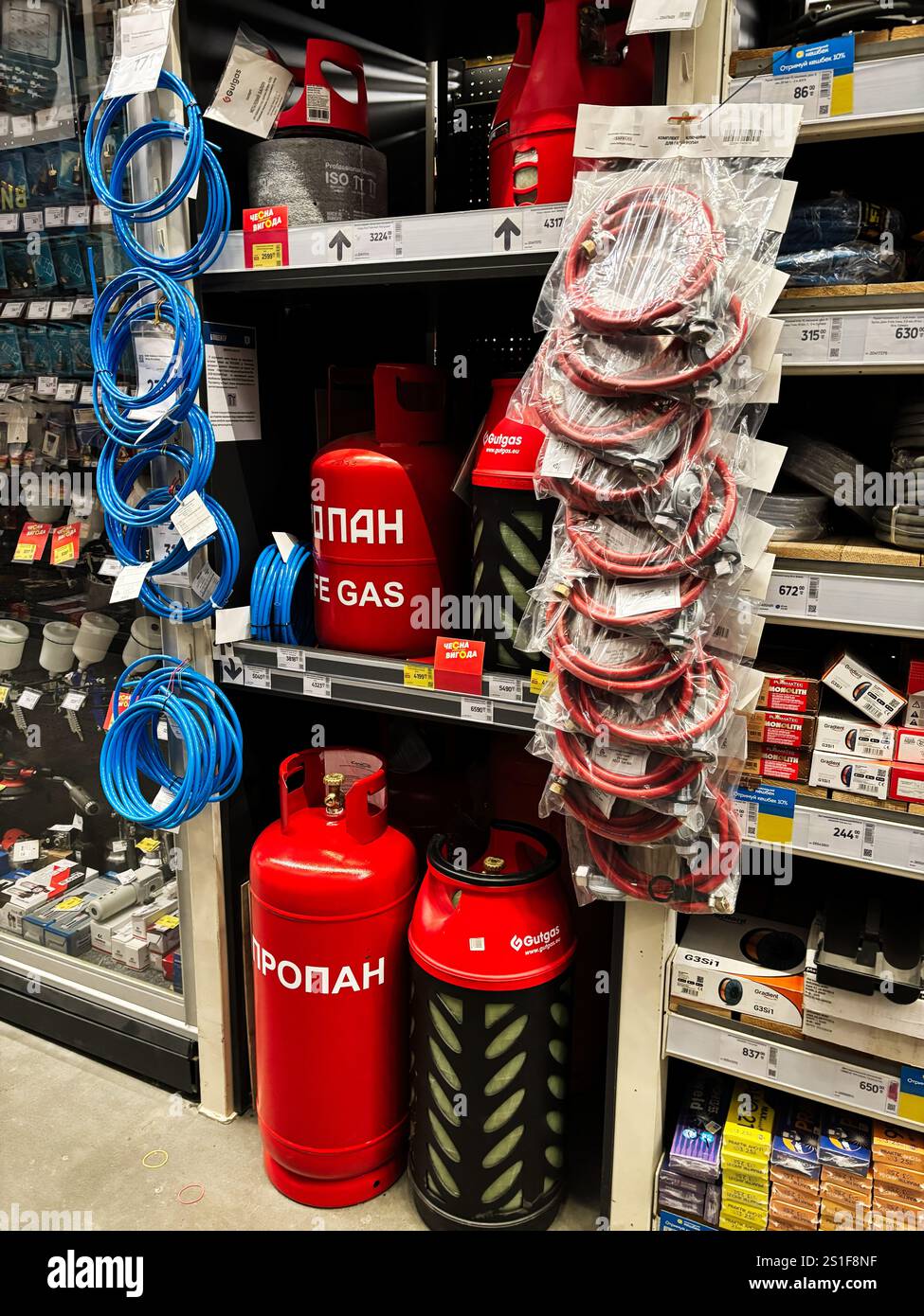 Kyiv, Ukraine - January 03, 2025: Various propane gas tanks in red ...
