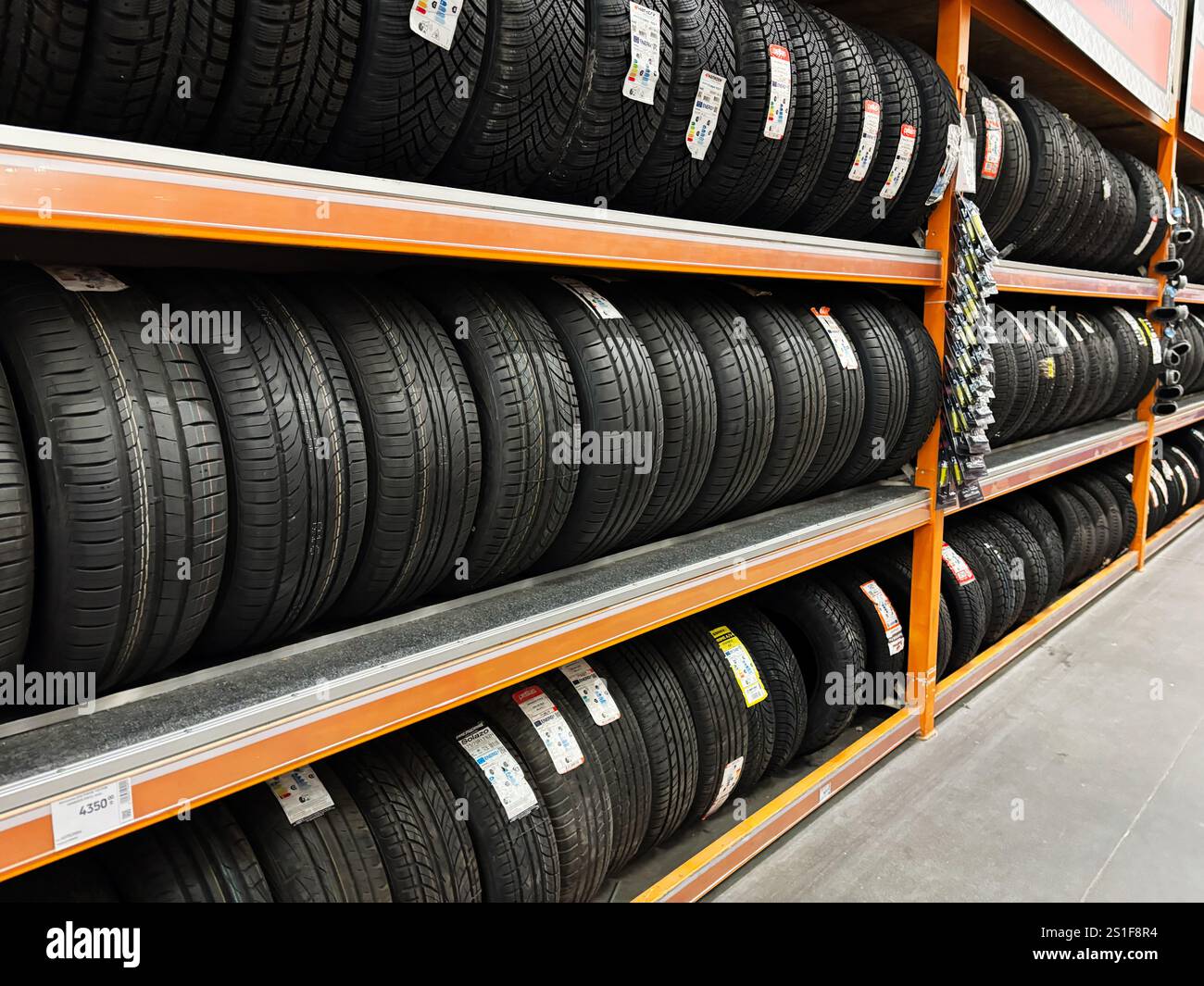 Kyiv, Ukraine - January 03, 2025: Array of brand new car tires ...