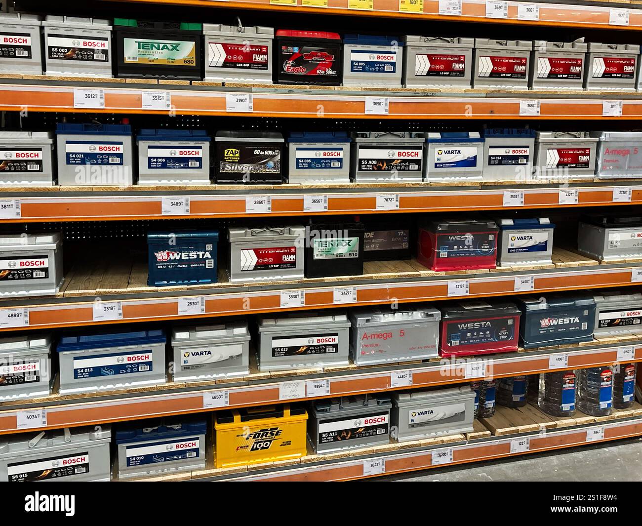Kyiv, Ukraine - January 03, 2025: Display of diverse car batteries ...