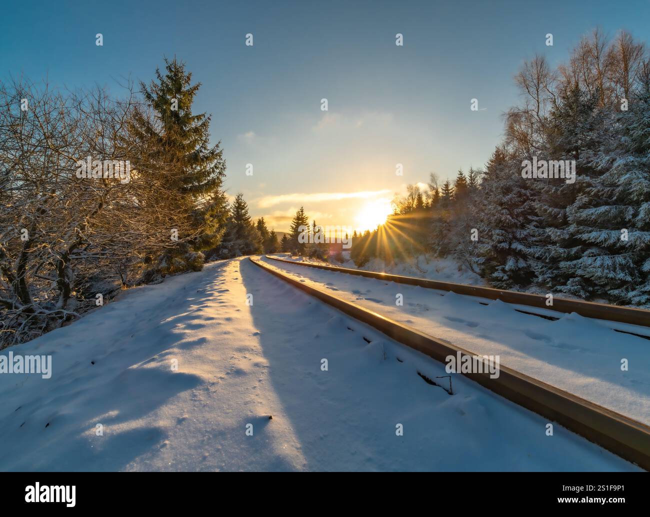 Cold winter morning with sunrise near old station in mountains in ...