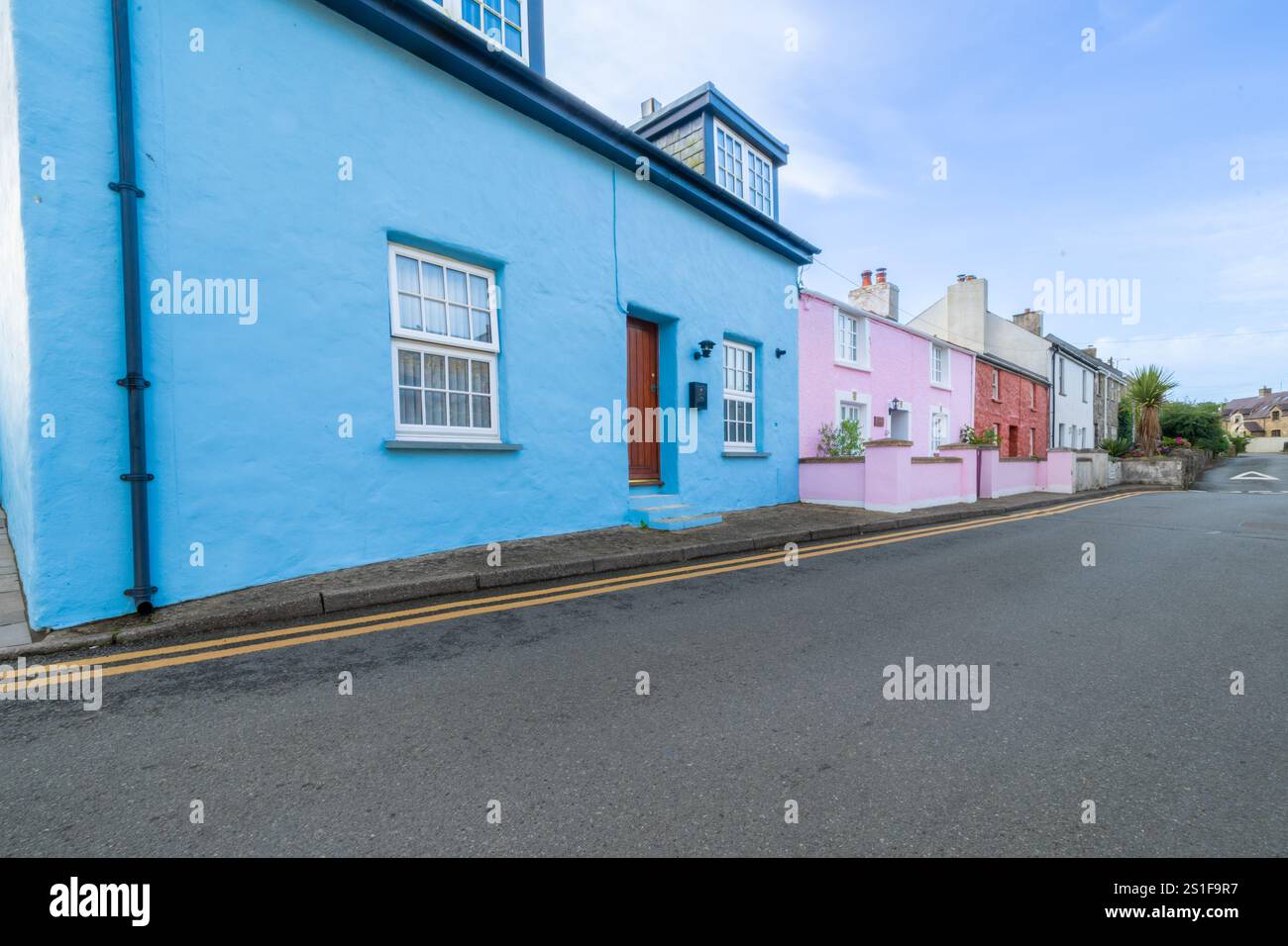 St.David's Wales - August 3 2024; Welsh city buildings joined colourful ...