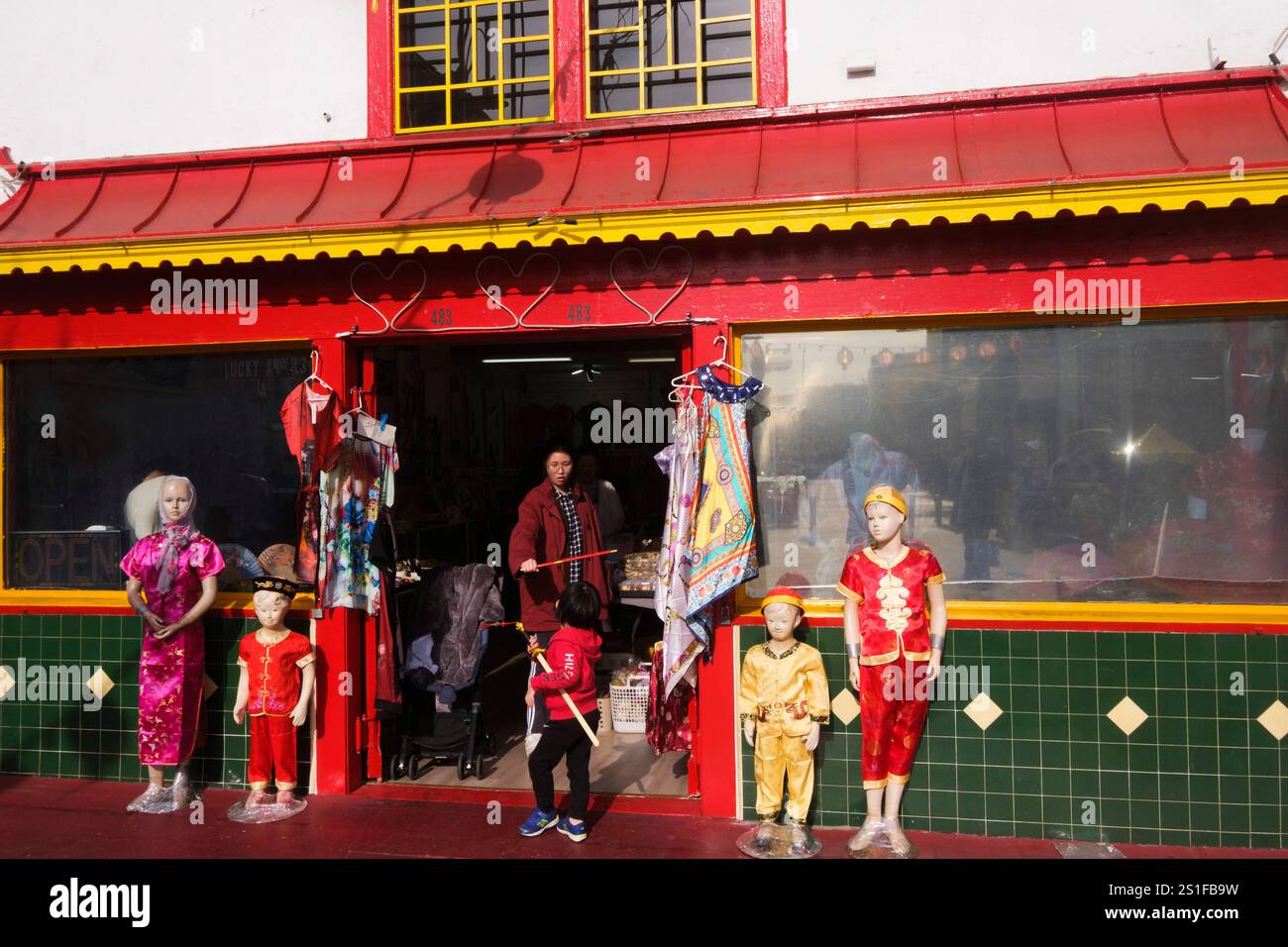 A child plays at sword fighting, Chinatown, Los Angeles, California ...