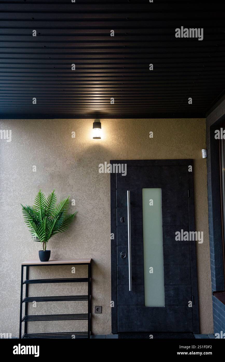 Entrance door to the house with a rectangular window Stock Photo - Alamy