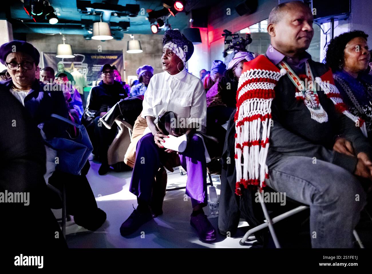AMSTERDAM - Attendees sing during a Singi Neti for Desi Bouterse. The ...
