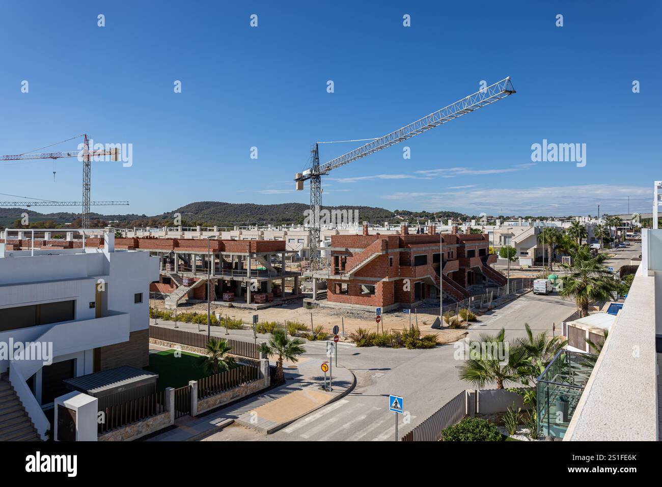 A developing residential neighborhood with partially built houses ...