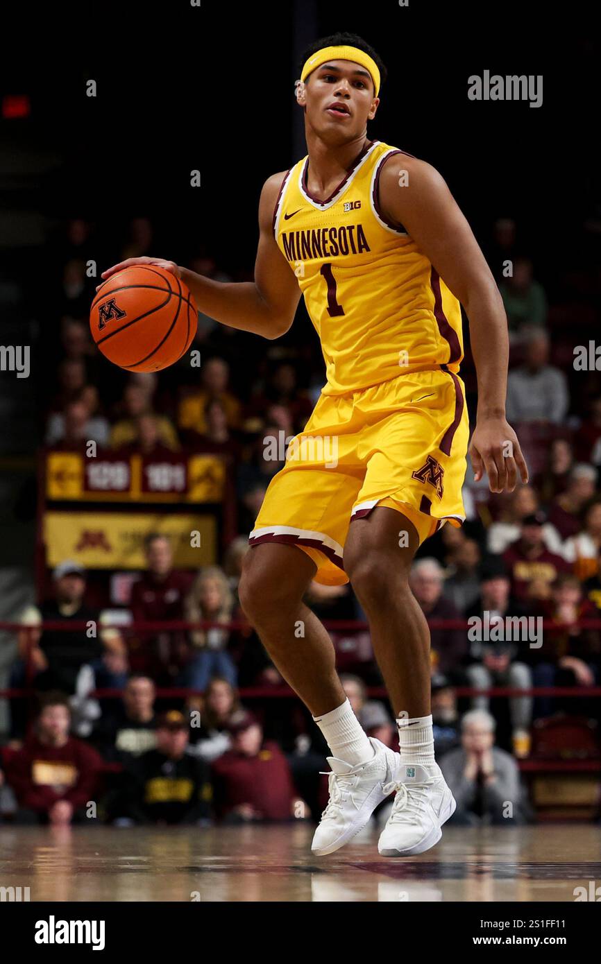 Minnesota guard Isaac Asuma (1) dribbles the ball during the first half ...