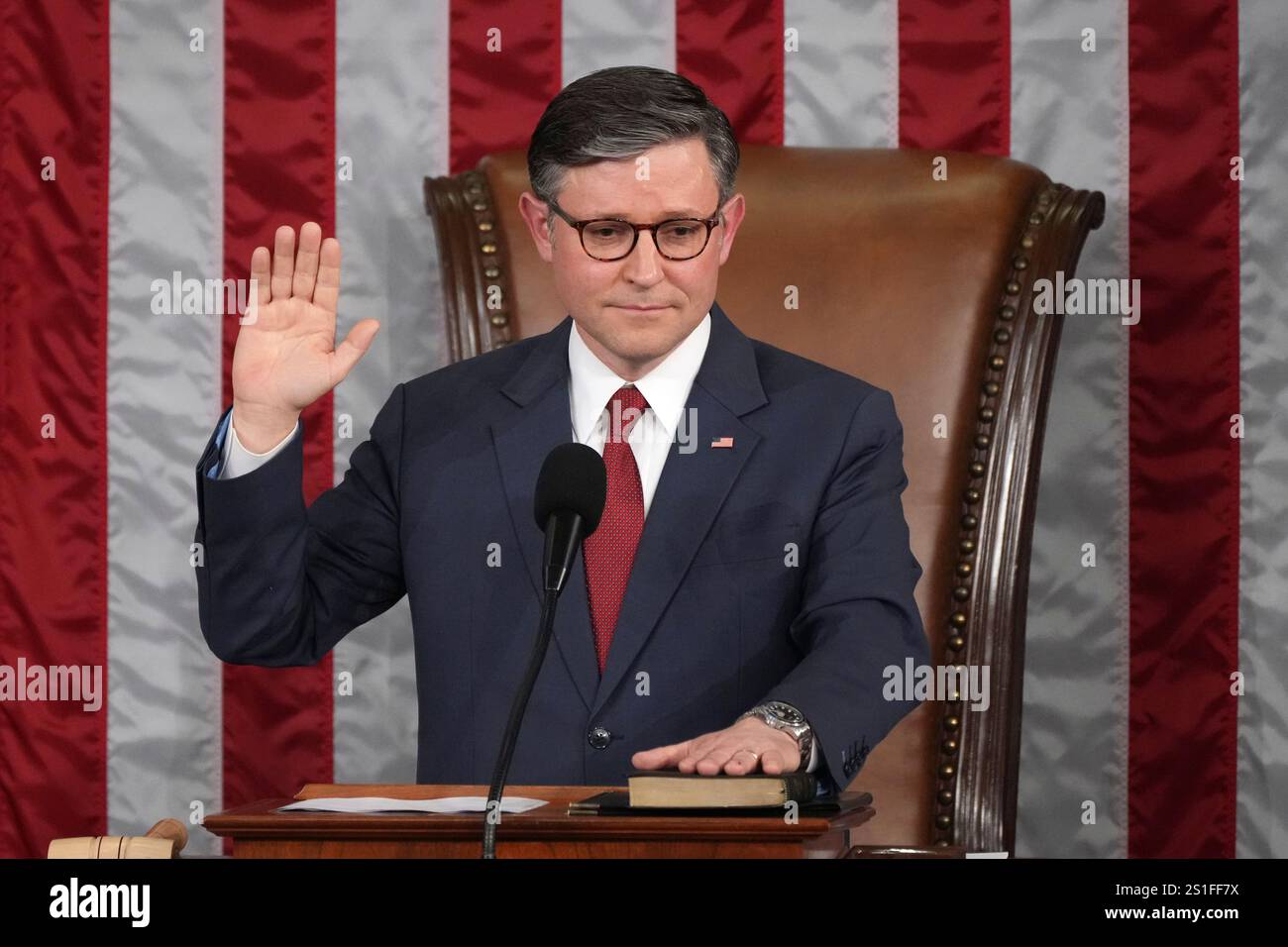 House Speaker Mike Johnson, R-La., takes the oath of office after being ...
