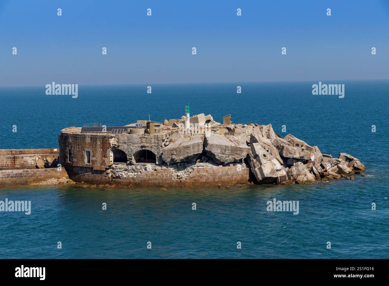 Ruined wartime defences on breakwater harbour wall, Port of Cherbourg ...