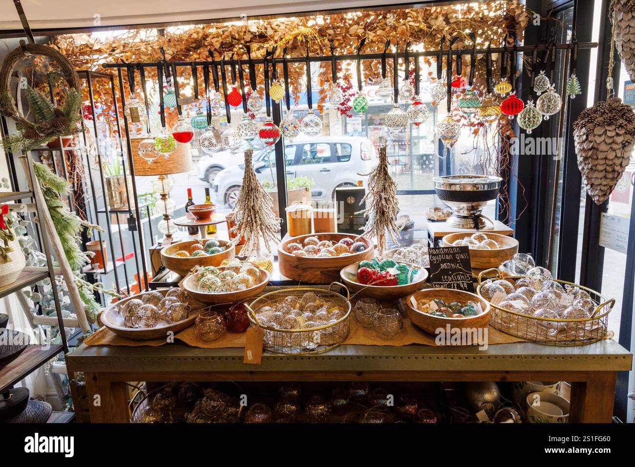 Shop window with Christmas decorations from inside, Wales, UK Stock ...