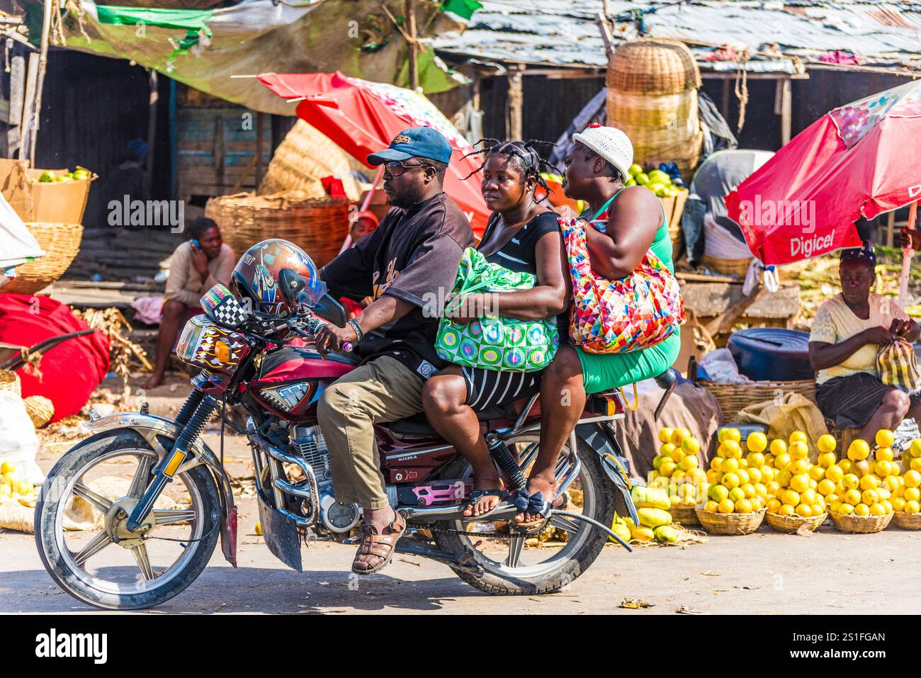 Three people on a motorcycle hi-res stock photography and images - Alamy