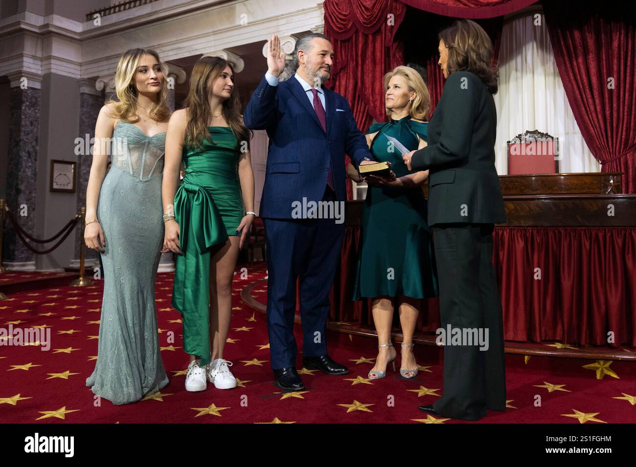 Sen. Ted Cruz, R-Texas, center, with his family, re-enacts being sworn ...