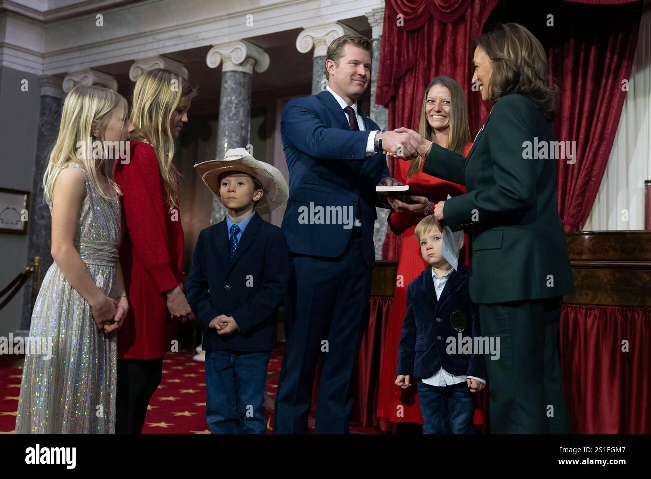 Sen. Tim Sheehy, R-Mt., center, with his family, re-enacts being sworn ...