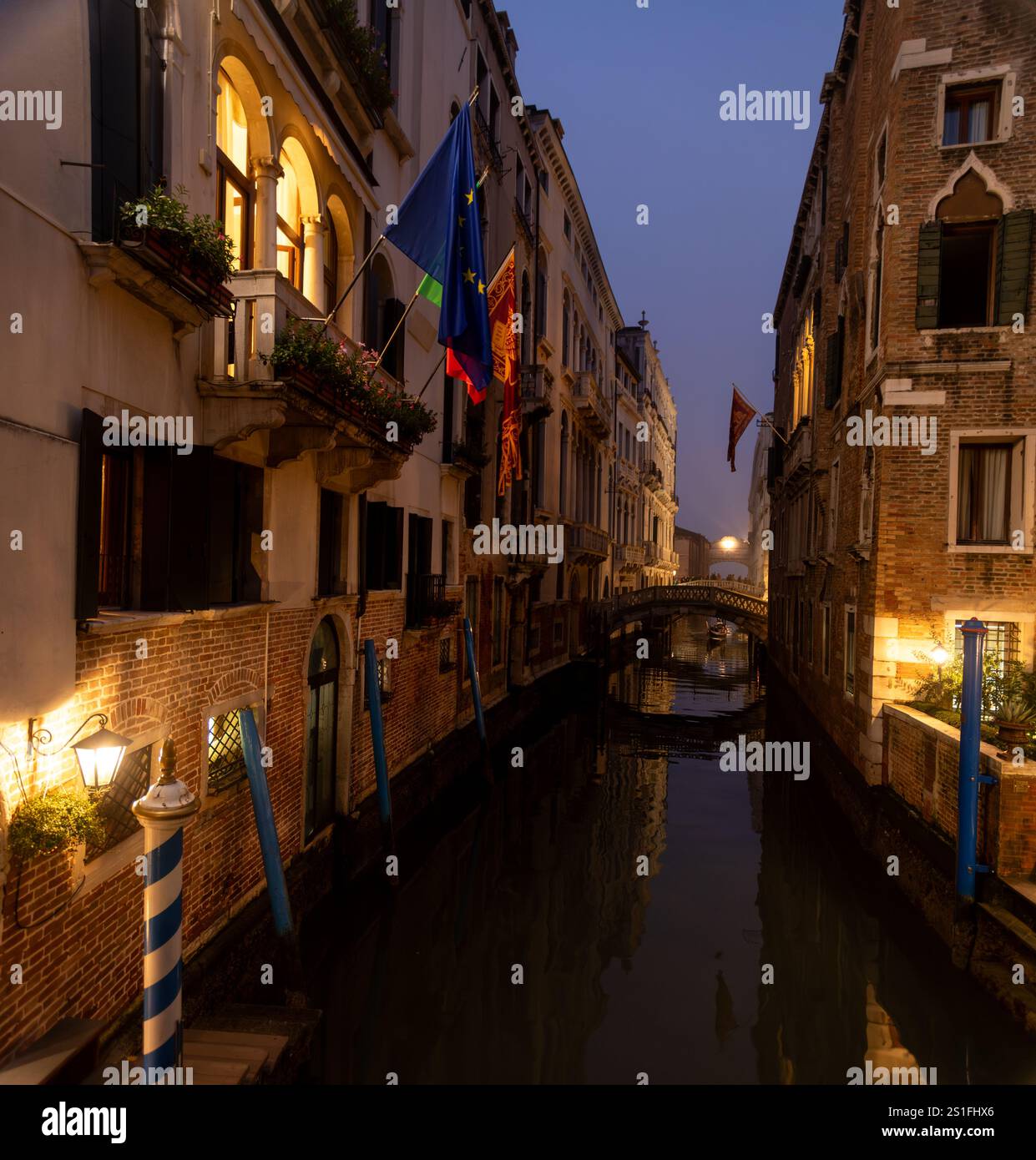 Venetian canal in the evening. Reflection of the medieval city in the ...