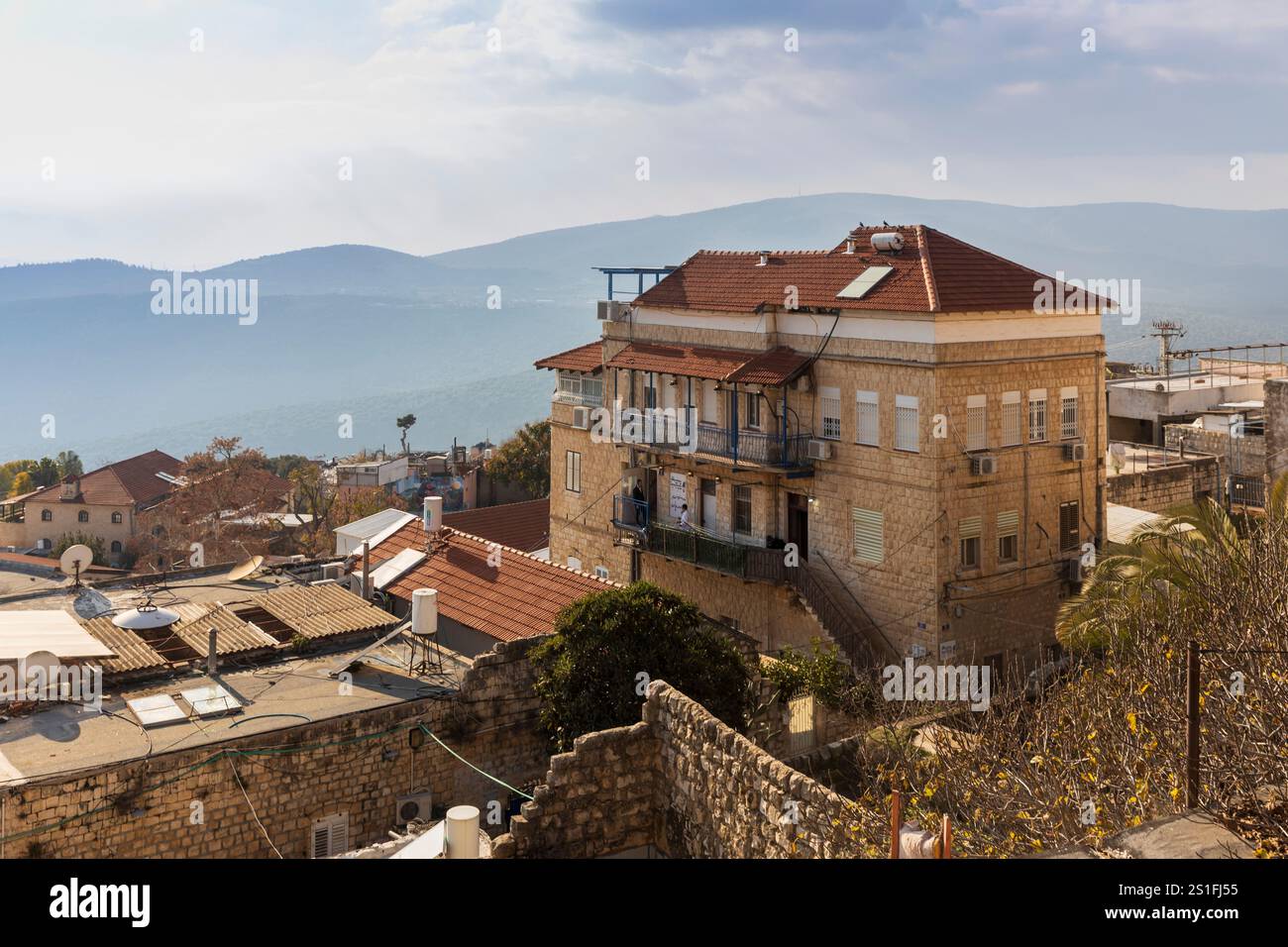 Tzfat, Israel – January 2, 2025, A stone-clad house with balconies and ...