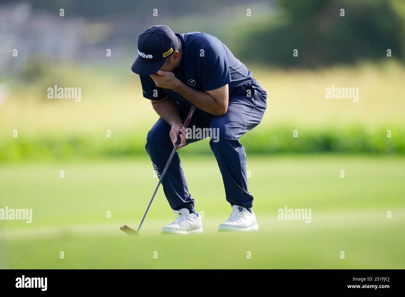 Jason Day, of Australia, misses a putt at the second hole during the ...