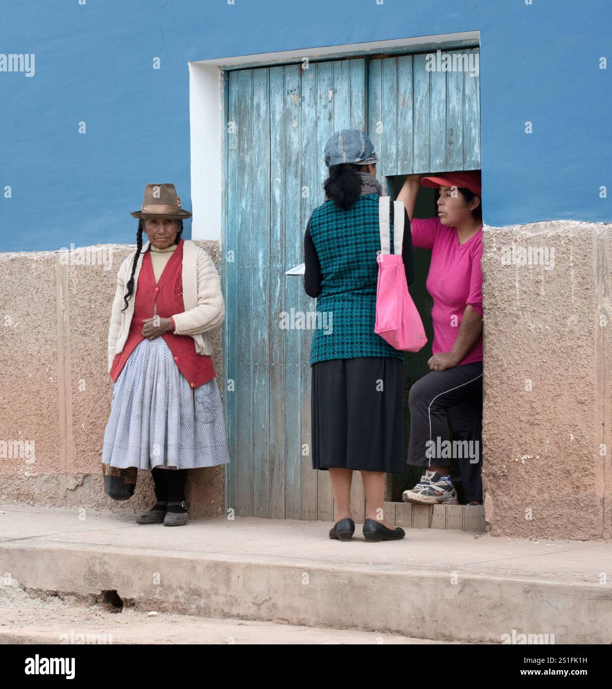 07/26/2018 - Maras, Peru: A candid scene featuring women engaging in ...