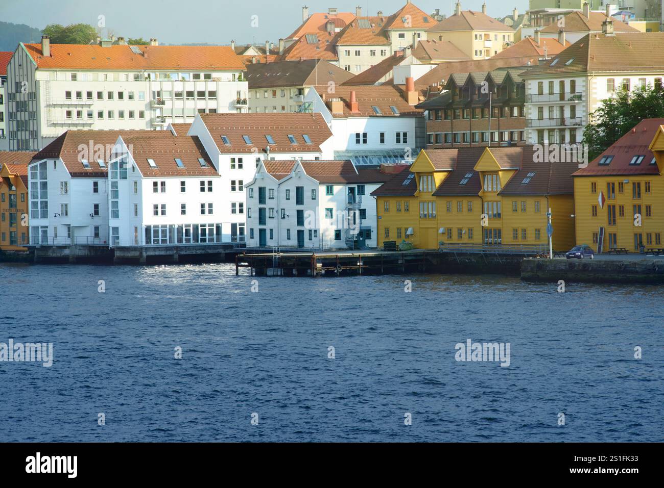 Colorful historic buildings line Bergen's harbor, showcasing ...