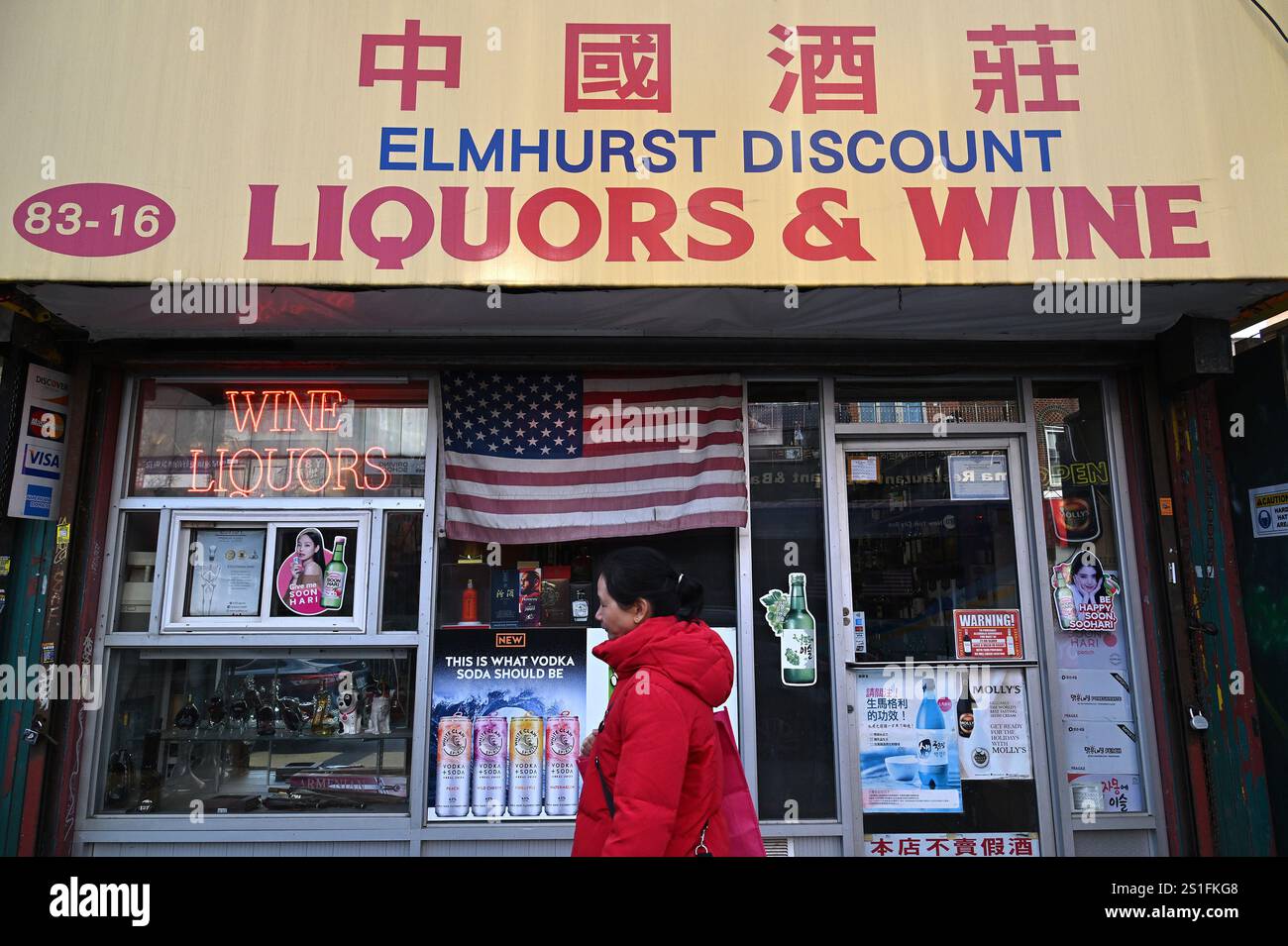 New York, USA. 03rd Jan, 2025. A woman walks past a liquor store in the ...