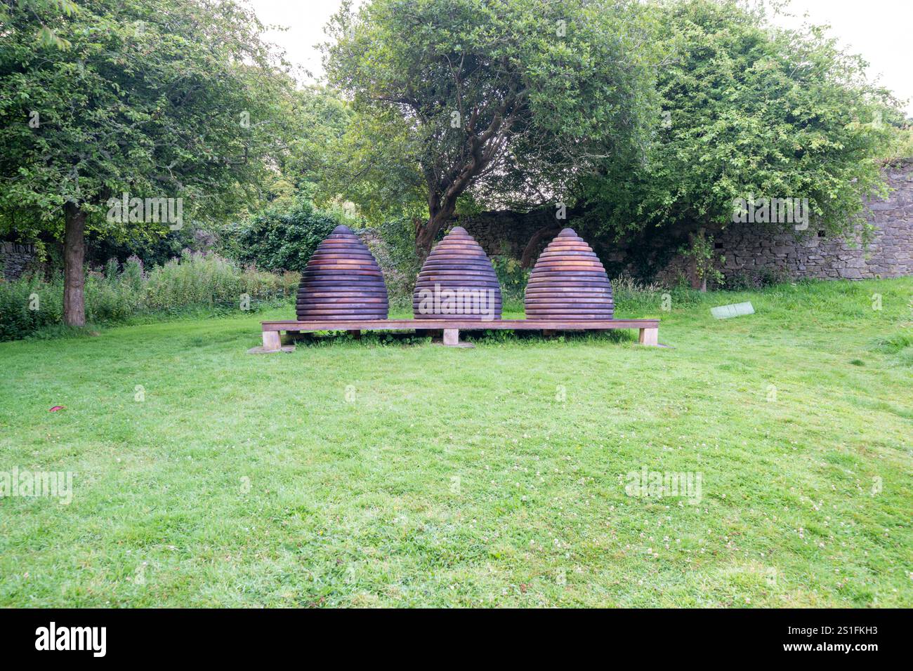 Beehives in old-fashioned stacked circular ring style like skeps grass ...