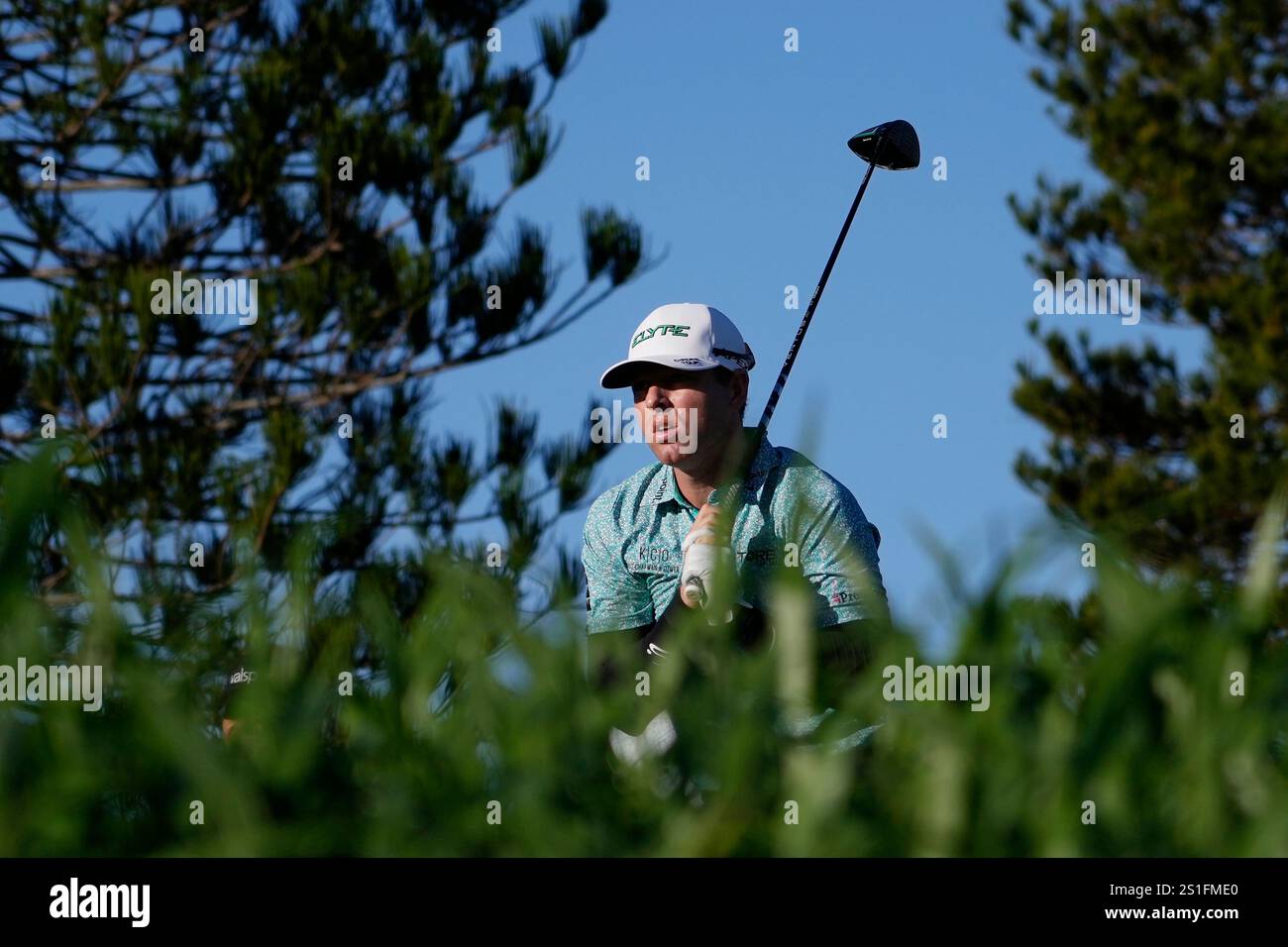Max Greyserman watches his tee shot at the third hole during the second ...