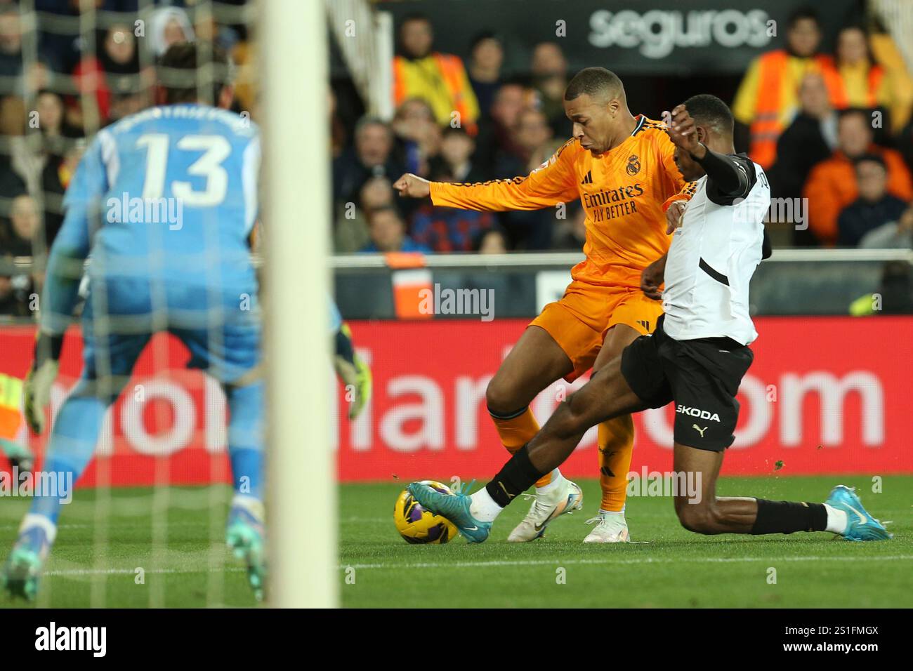 Real Madrid's Kylian Mbappe, left, and Valencia's Cristhian Mosquera ...