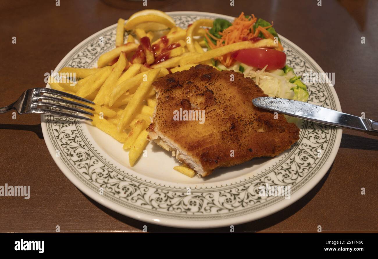 Breaded Wiener Schnitzel with French fries, Bavaria, Germany, Europe ...